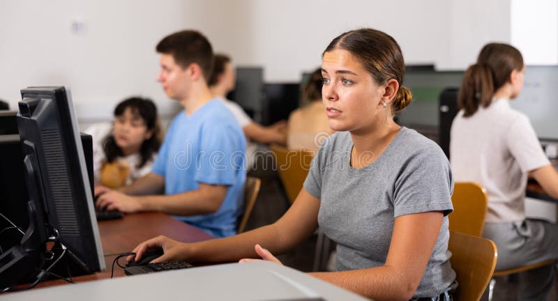 Concentrated Female Student Using PC and Studying Computer Science in ... Concentrated Female Student Using PC and Studying Computer Science in ...