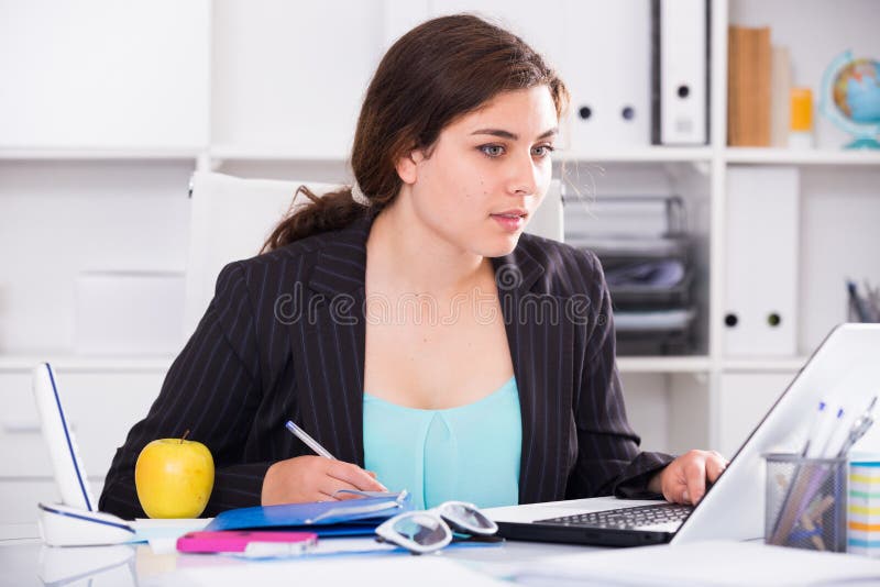 Concentrated Female Trainee is Having Productive Day at Work Stock ...