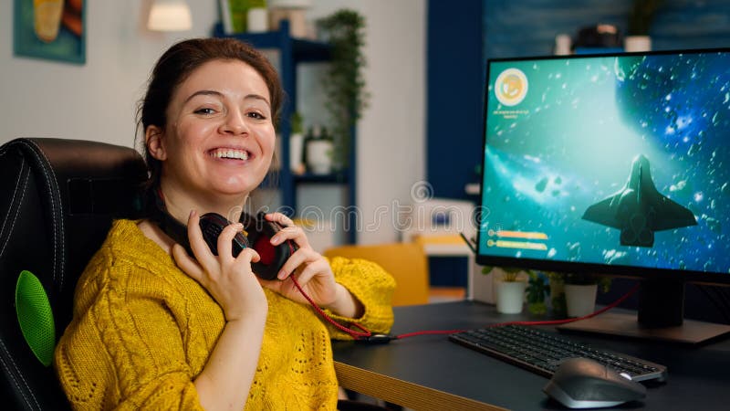 Concentrated Gamer Looking at Camera while Playing Game Stock Photo ...