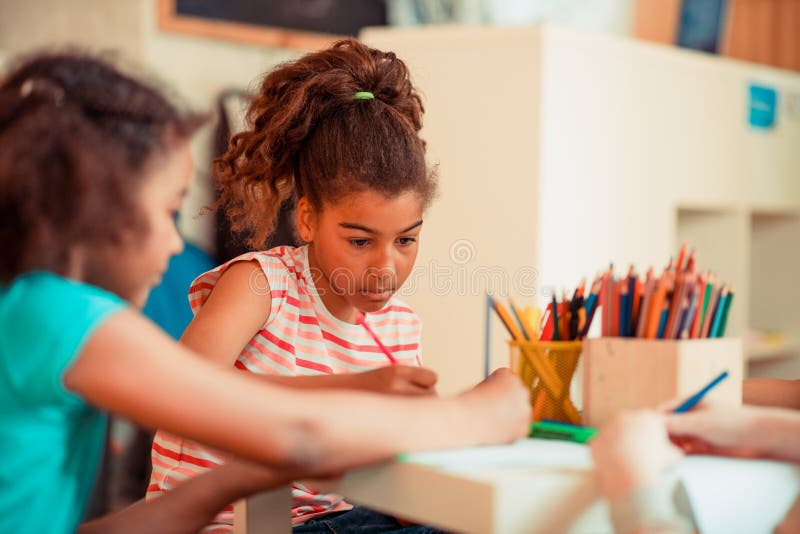 Concentrated Girl Drawing Her New Picture during the Art Class Stock ...