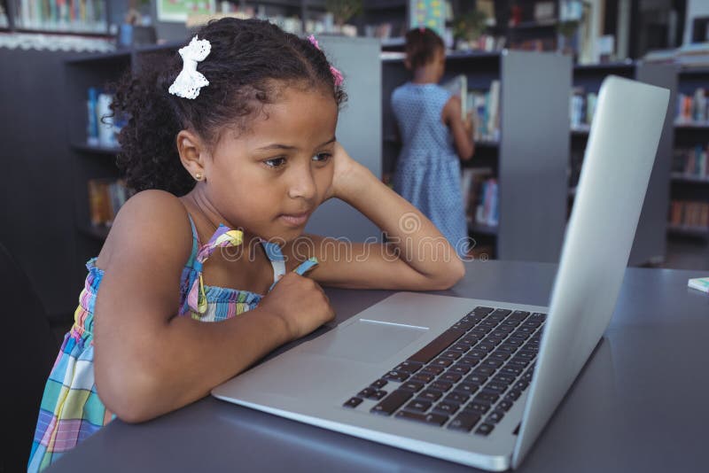Concentrated Girl Looking at Laptop in Library Editorial Photography ...
