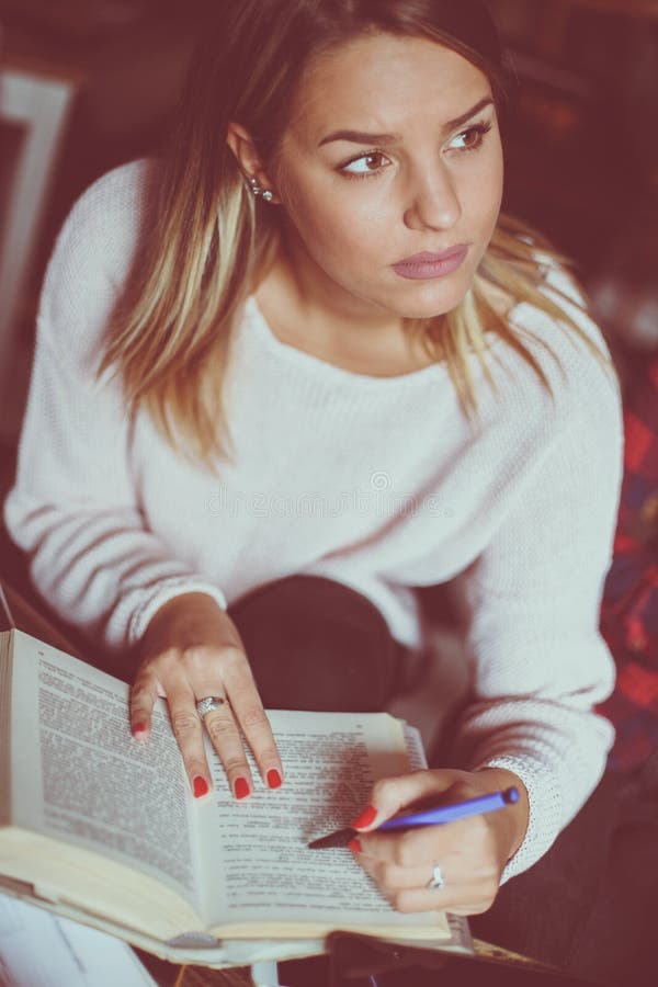 Concentrated Girl Student Writing Homework and Looking Up. Stock Photo ...