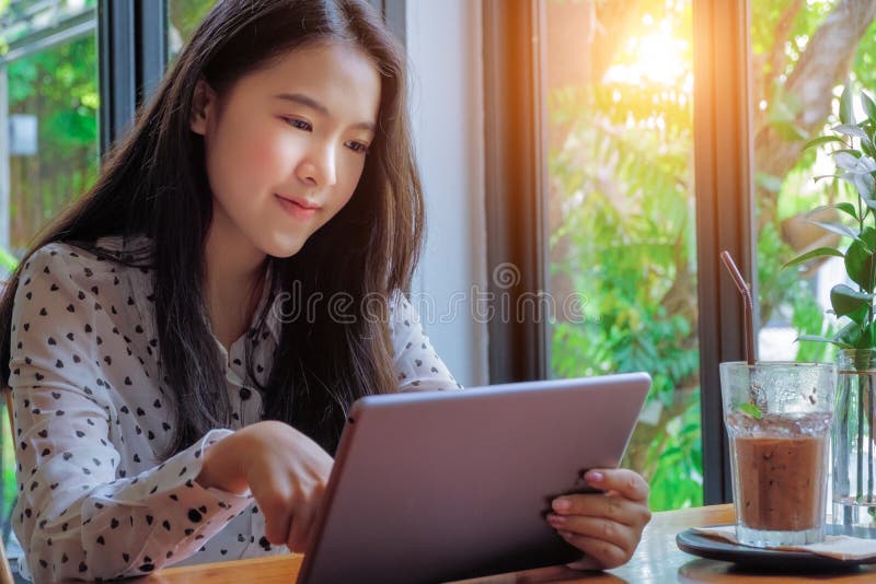 Girl Smiling while Typing on Computer. Stock Photo - Image of asian ...