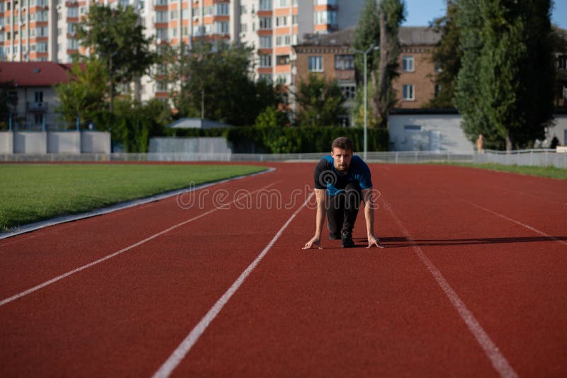 Concentrated Guy is Ready To Run at the Stadium Stock Photo - Image of ...