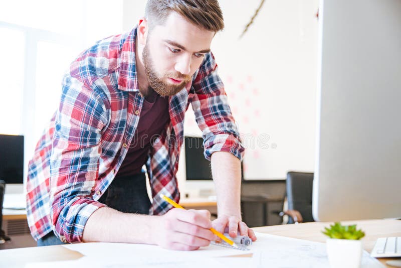 Concentrated Handsome Man Working and Drawing Blueprint Stock Image ...