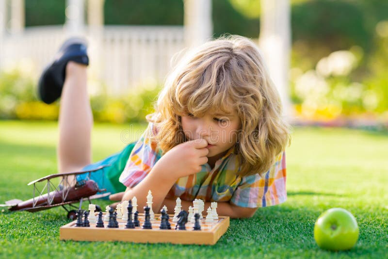Concentrated Kid Developing Chess Strategy, Playing Board Game in ...