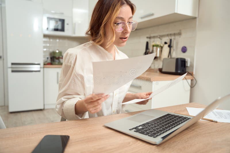 Concentrated Lady with Papers Sitting at Portable Computer Stock Image ...