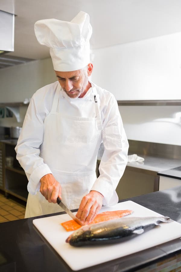 Concentrated Male Chef Cutting Fish in Kitchen Stock Image - Image of ...