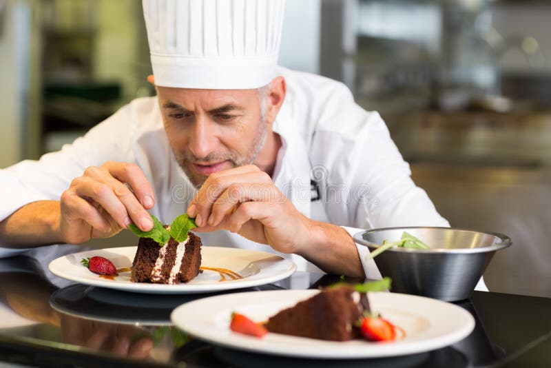 Concentrated Male Pastry Chef Decorating Dessert in Kitchen Stock Photo ...