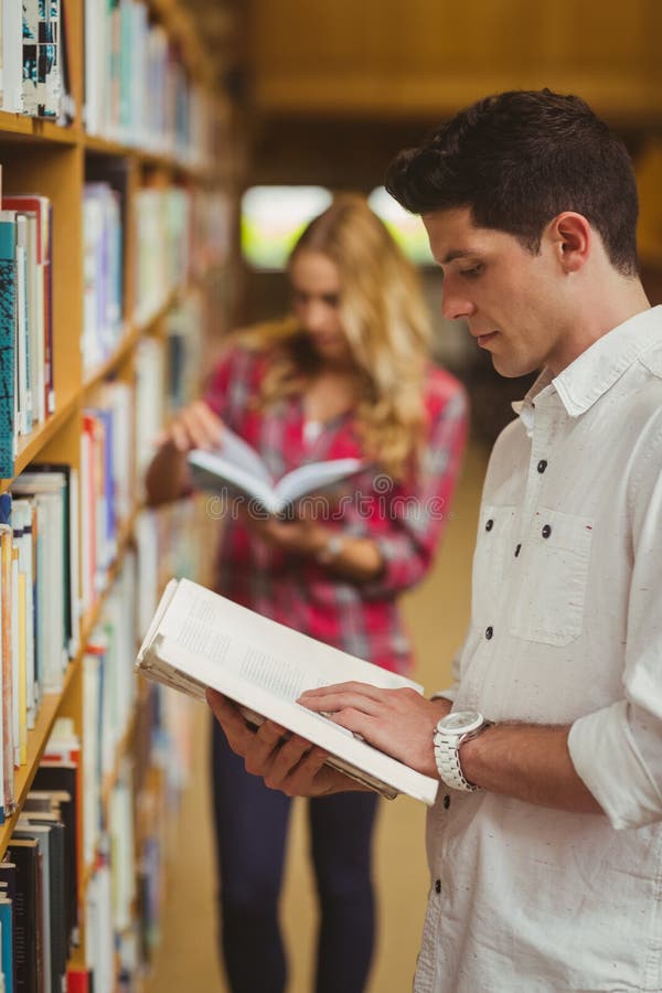 Concentrated Male Student Reading Book Stock Image - Image of research ...