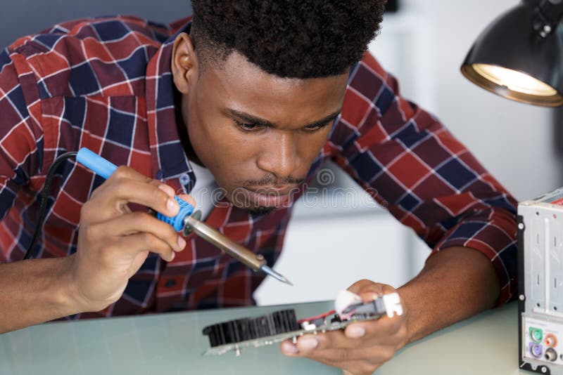 Concentrated Male Worker Soldering Mainboard Stock Image - Image of ...