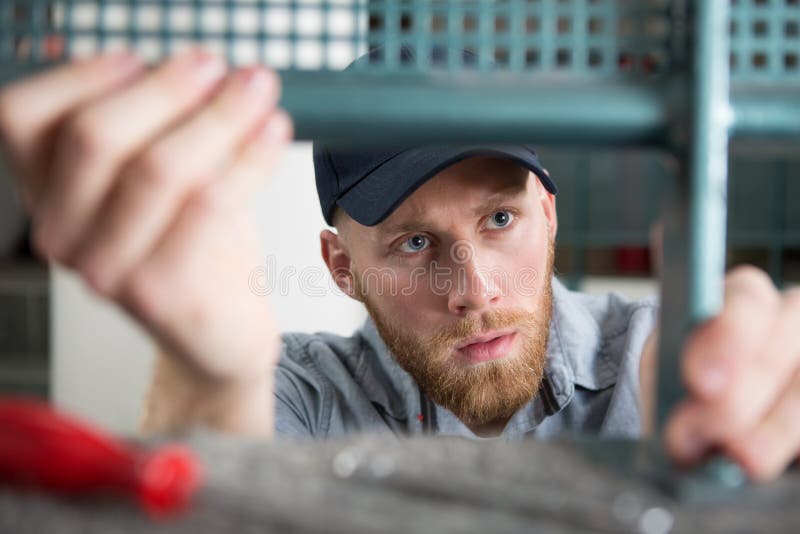 Concentrated Man in Fixing Chair Stock Photo - Image of industry ...