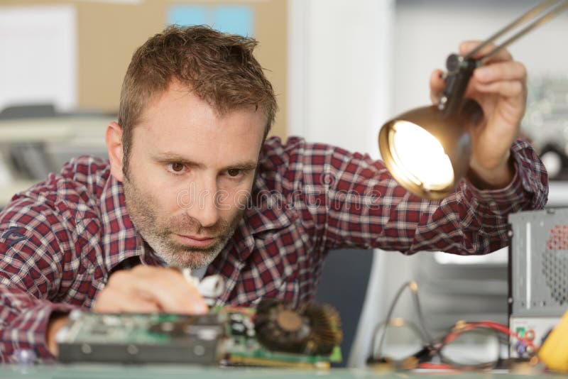 Concentrated Man Fixing Electronics Stock Image - Image of equipment ...