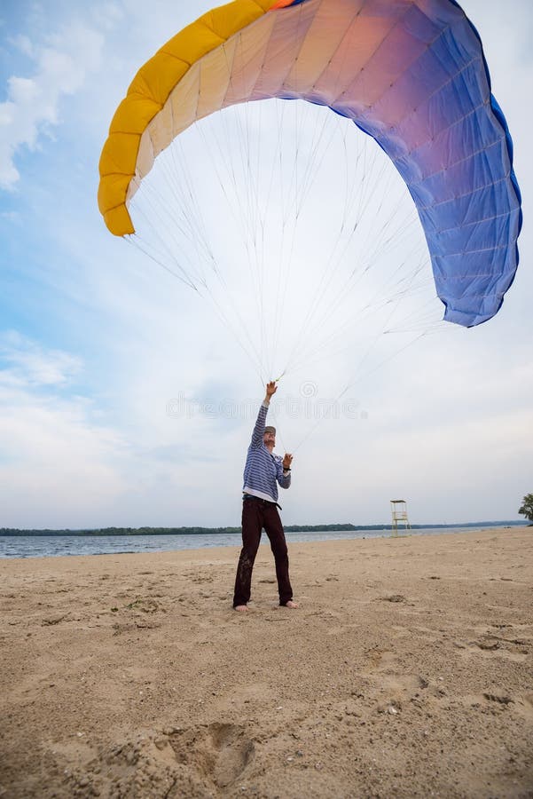 Concentrated Man is Practicing To Control a Paraglider Stock Image ...