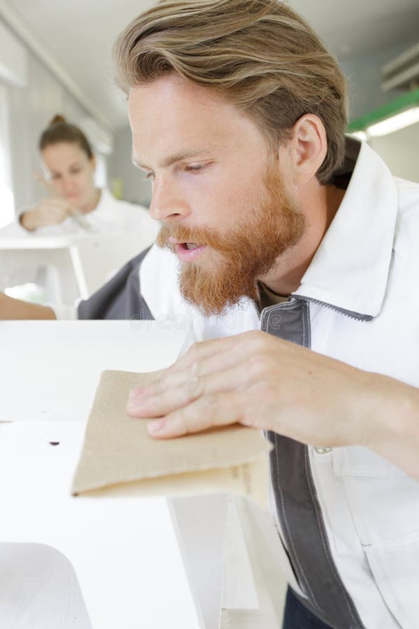 Concentrated Man Sanding Wood in Workshop Stock Image - Image of person ...