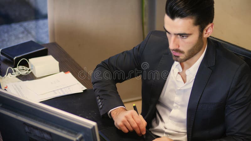 Concentrated Man Using Graphic Tablet in Office Stock Image - Image of ...