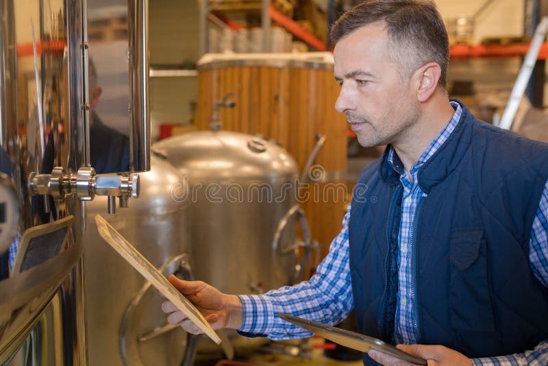 Concentrated Man Working on Beer Factory Stock Image - Image of smart ...