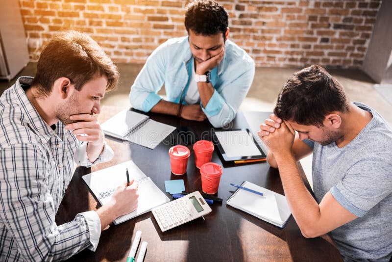 Concentrated Men Working on Project at Small Office Meeting Stock Image ...