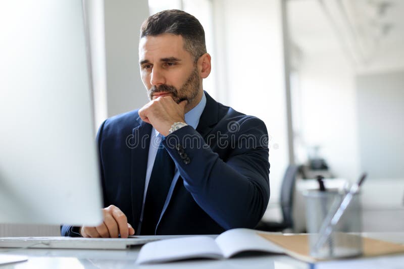 Concentrated Middle Aged Male Entrepreneur Working with Computer ...