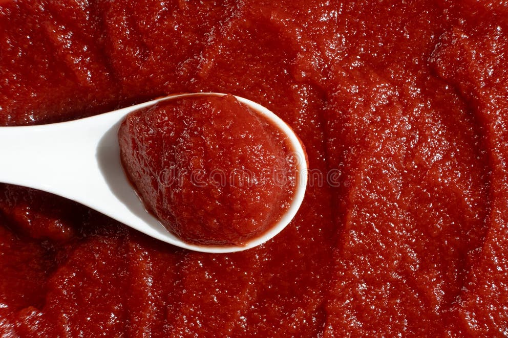 Concentrated Natural Tomato Paste in a Spoon, Macro Texture Stock Image ...