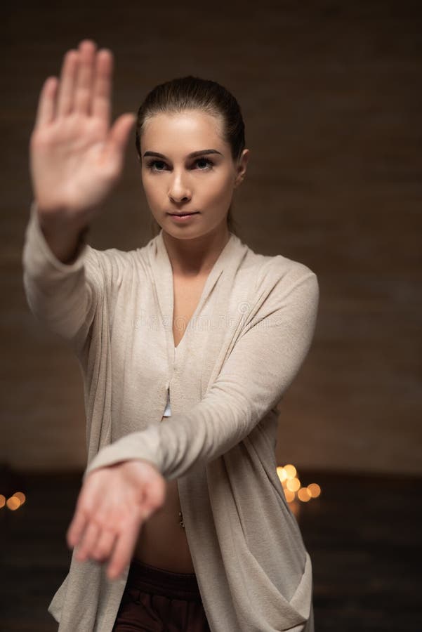 Serious Lady Standing Alone and Putting Hands in Front of Her Face ...