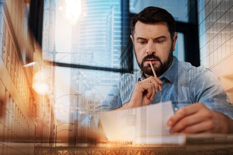 Concentrated Person Looking Thoughtful while Reading a Letter Stock ... Concentrated Person Looking Thoughtful while Reading a Letter Stock ...
