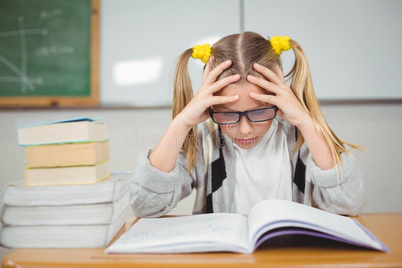 Concentrated Pupil Reading Book at Her Desk Stock Image - Image of ...