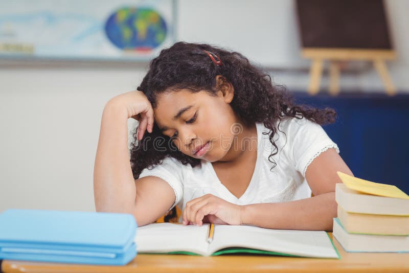 Concentrated Pupil Reading Notepad in a Classroom Stock Image - Image ...