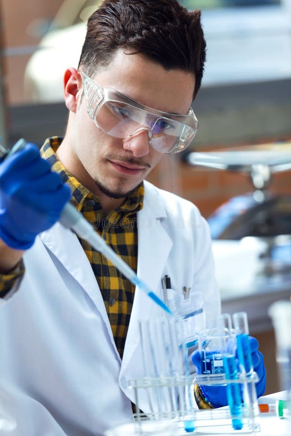 Concentrated Scientist Making Experiment in Laboratory. Stock Photo ...