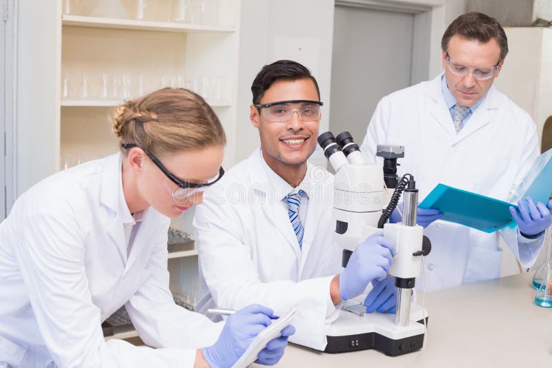 Concentrated Scientists Working Together Stock Image - Image of biology ...