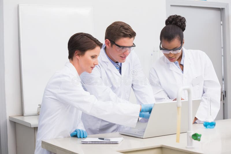 Scientists Working in a Laboratory Stock Photo - Image of chemical ...