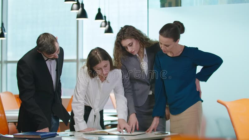 Concentrated Serious Employees Leaning on Table Talking Discussing ...