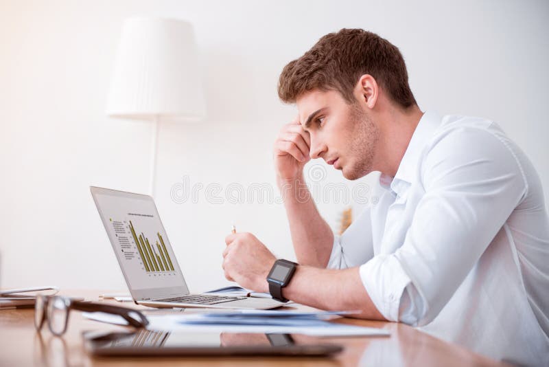 Concentrated Serious Man Sitting at the Table Stock Photo - Image of ...