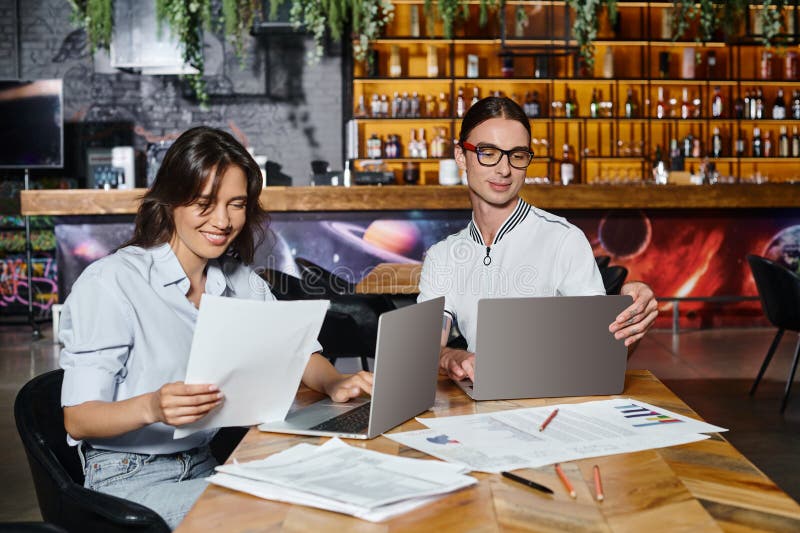 Concentrated Smiley Colleagues Working on Documents Stock Image - Image ...