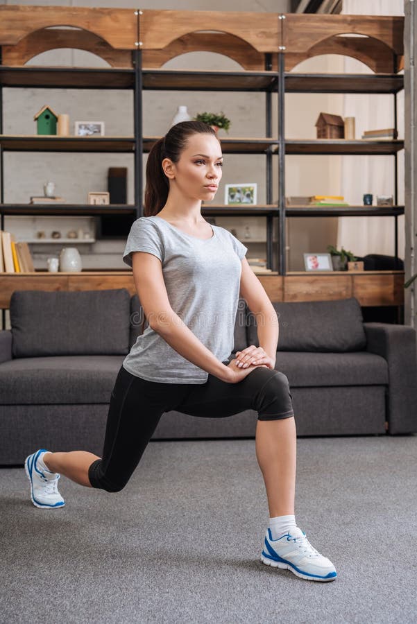 Concentrated Sportswoman Doing Lunge Exercise Stock Photo - Image of ...