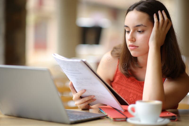 Concentrated Student Memorizing Notes in a Bar Stock Image - Image of ...