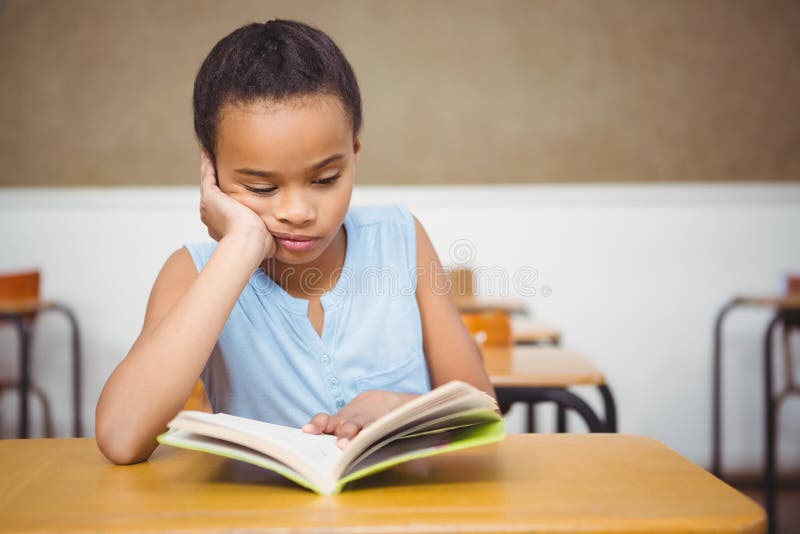 Concentrated Student Reading a Book Stock Photo - Image of back ...
