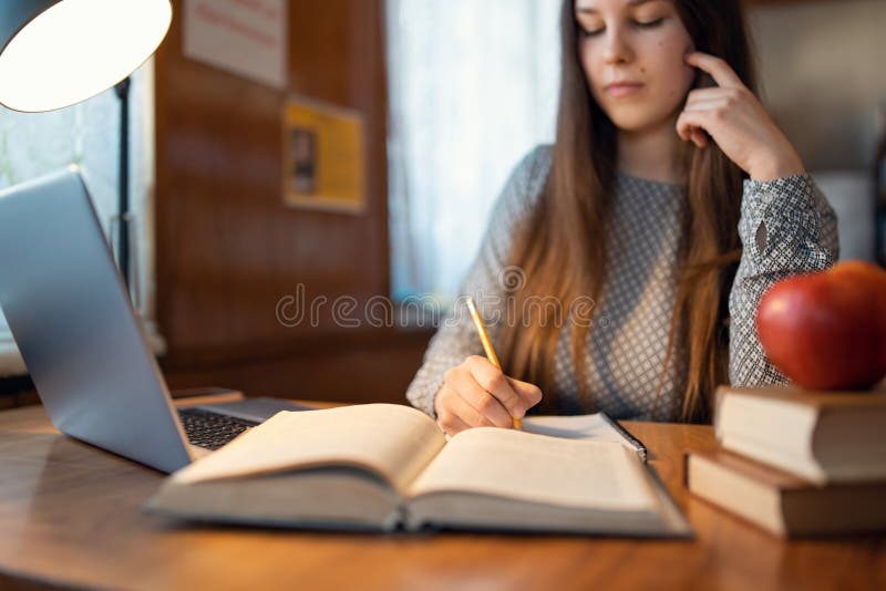 Concentrated Student Reading a Book and Takes Notes, Prepare for ...