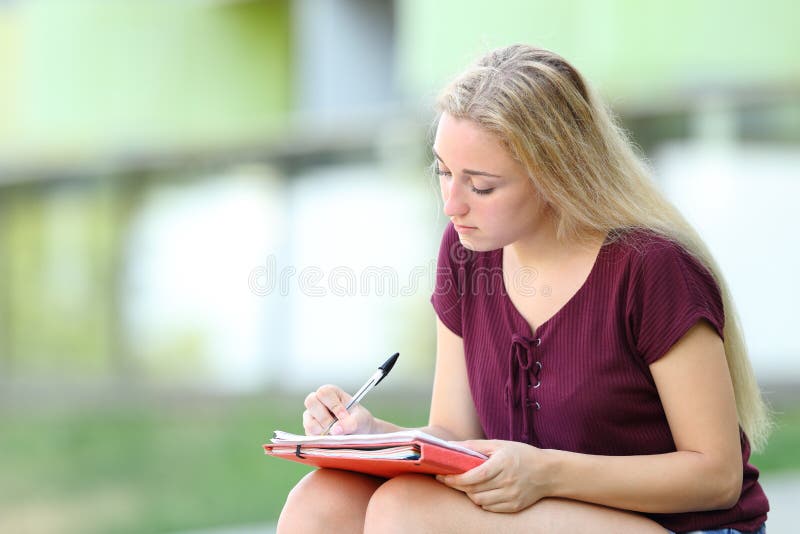 Concentrated Student Studying Taking Notes In A Campus Stock Image ...