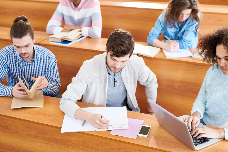 Concentrated Students Doing Task at Class Stock Photo - Image of ...