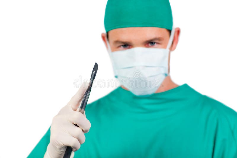 Concentrated Surgeon Holding a Scalpel Stock Photo - Image of ...