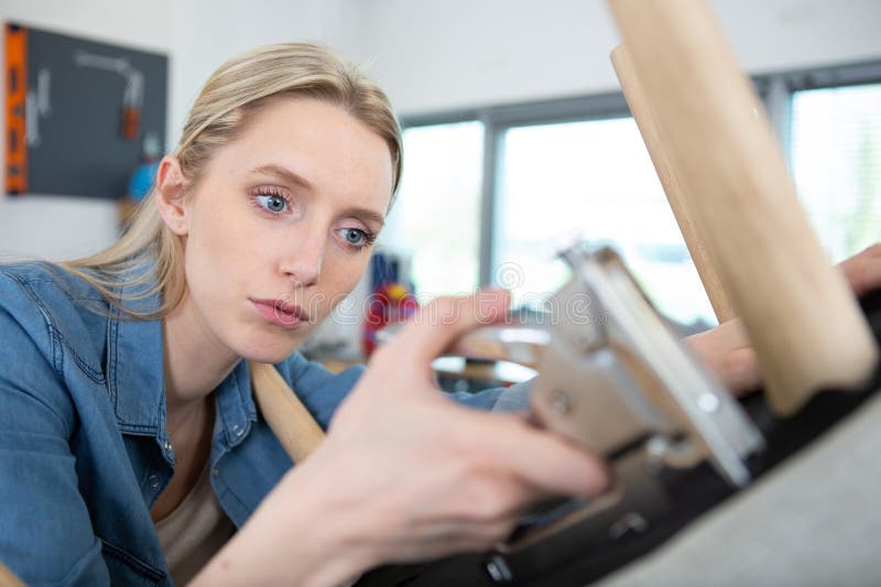 Concentrated Woman Fixing Chair with Staple Stock Photo - Image of ...