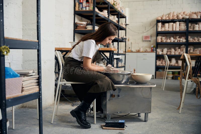 Woman Making Pot Using Pottery Wheel in Creative Studio Stock Photo ...