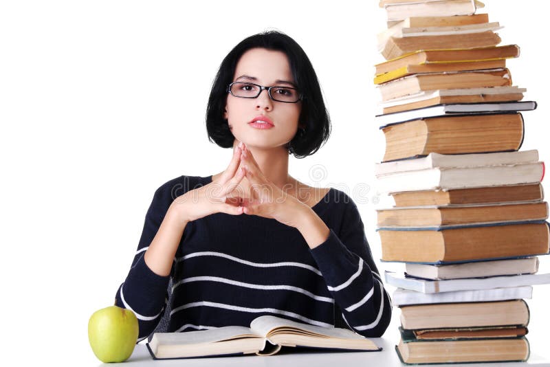 Concentrated Woman Sitting with Stack of Books Stock Photo - Image of ...