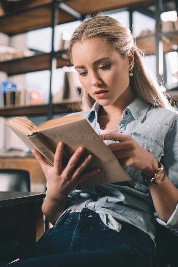 Concentrated Woman Student Reading Book in Library Stock Photo - Image ...