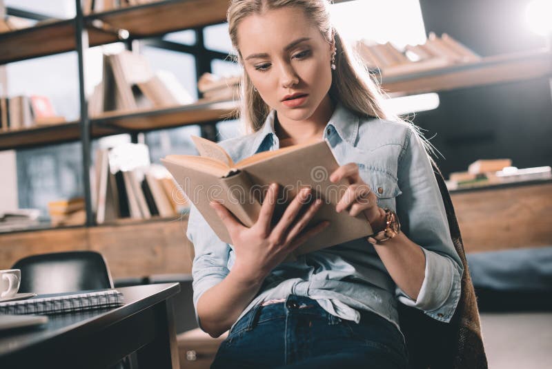 Concentrated Woman Student Reading Book in Library Stock Photo - Image ...