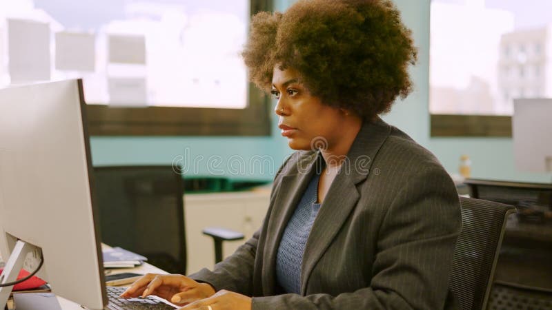 Concentrated Woman Working Using Computer in a Coworking Stock Photo ...