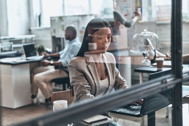 Concentrated Young Woman Work in Office Using Computer Stock Image ...