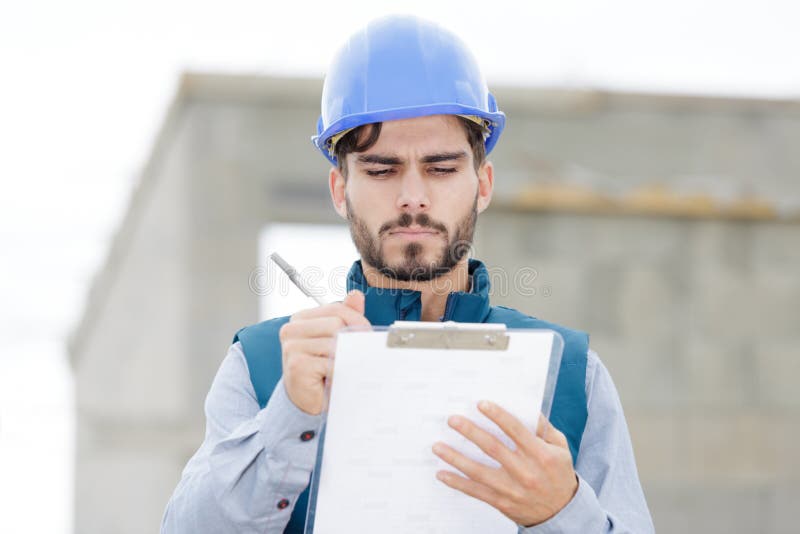 Concentrated Worker Holding Clipboard Outdoors Stock Image - Image of ...