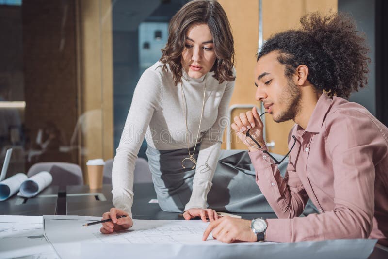 Concentrated Young Architects Working Together Stock Image - Image of ...